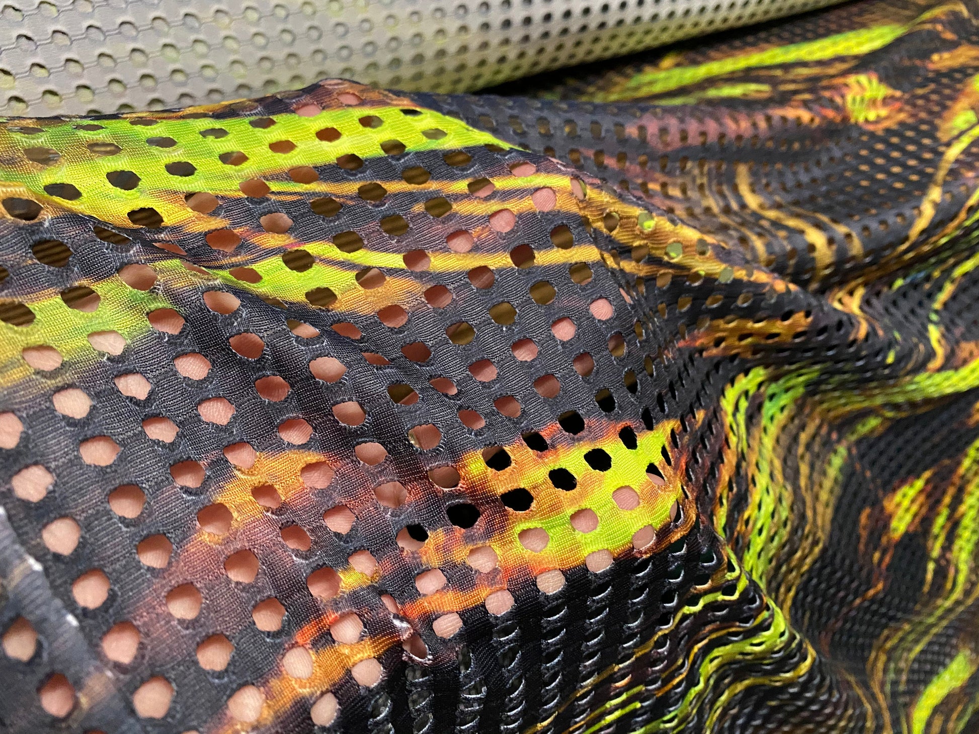 Laser cut fishnet mesh style jersey fabric, per metre - black & green ...